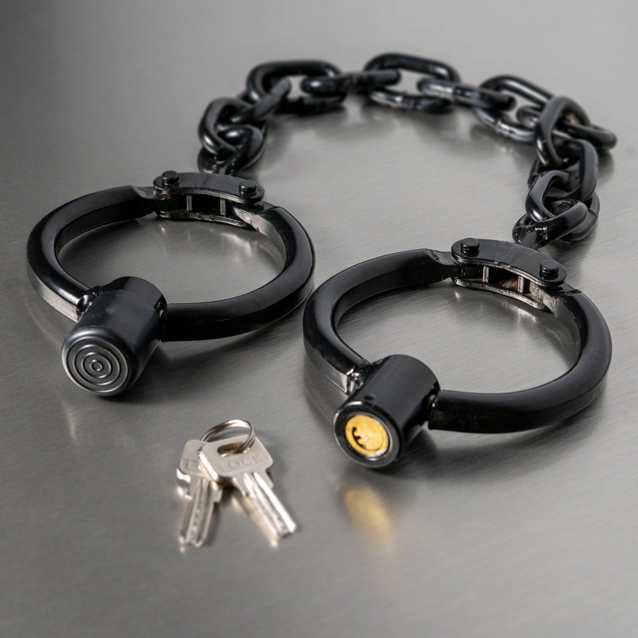 Very heavy leg irons with large chain in black – selfbondage-shop
